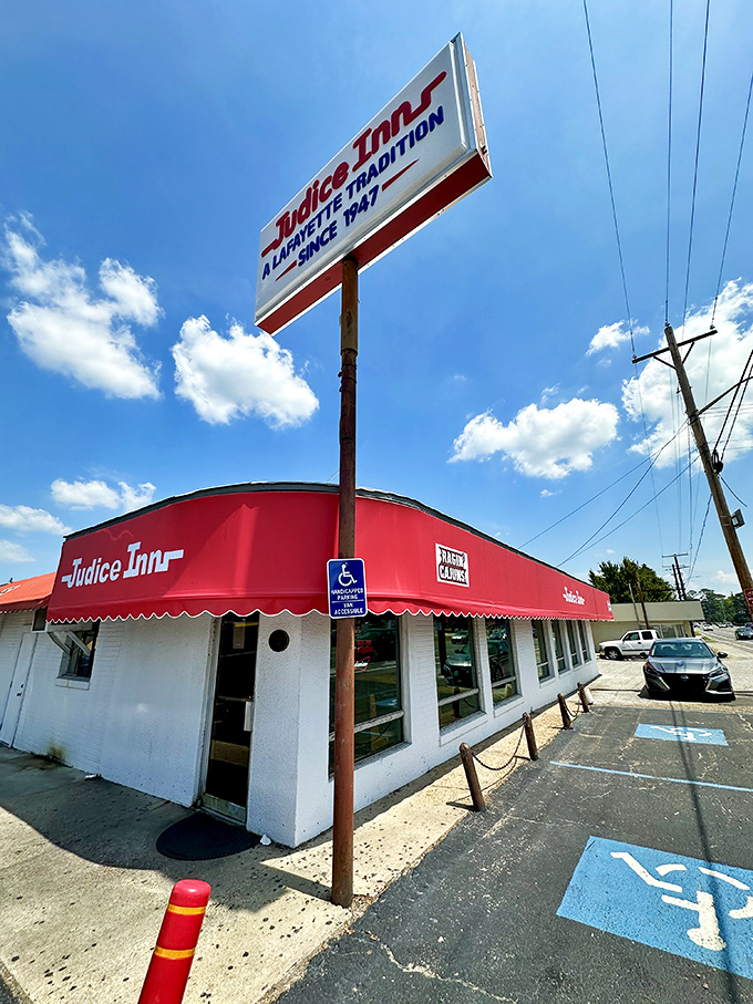 A beacon of burger bliss! Judice Inn's iconic red awning and retro sign promise a journey back to simpler, tastier times.