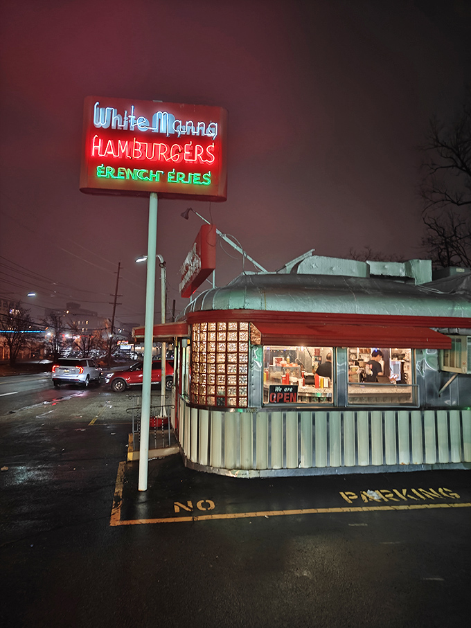 Neon dreams and burger schemes! White Manna's iconic sign beckons like a lighthouse for the hungry, guiding lost souls to slider salvation.