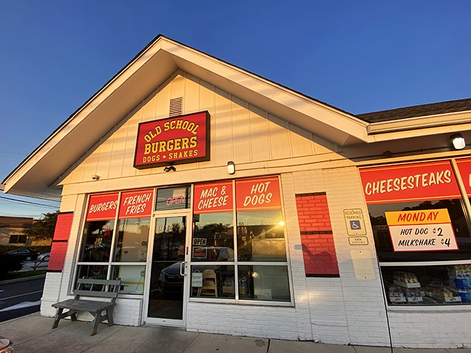 Welcome to burger paradise! Old School Burgers stands proud, its red shutters beckoning hungry travelers like a lighthouse for the famished.
