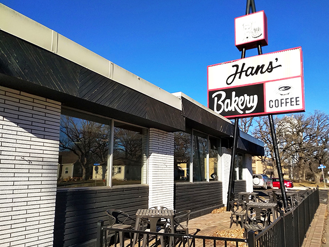 Welcome to carb heaven! Hans' Bakery's retro sign beckons like a siren call to donut lovers everywhere.
