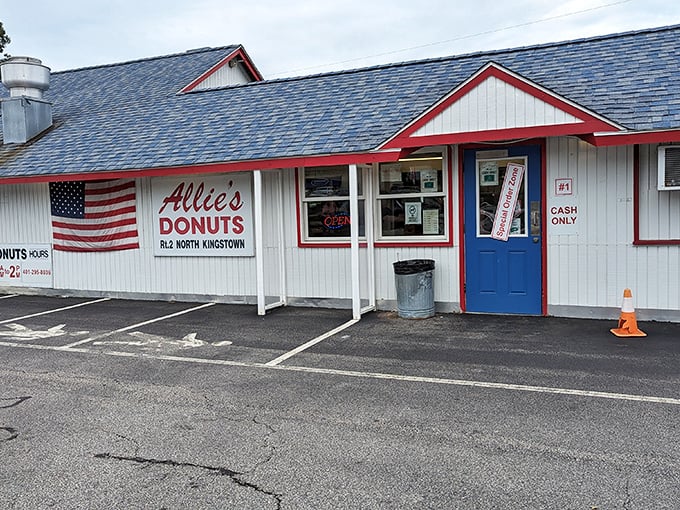 A slice of Americana with sprinkles on top! Allie's Donuts stands proud, its red-trimmed exterior promising sweet delights within.