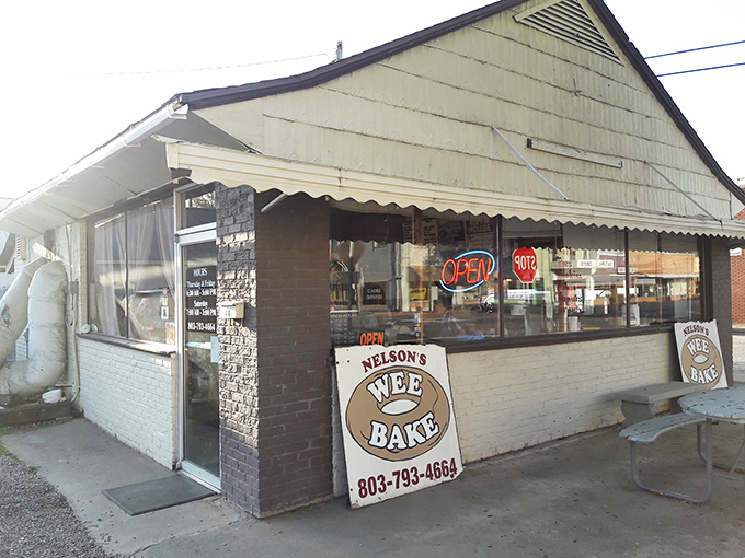 Welcome to donut paradise! Nelson's Wee Bake beckons with its charming exterior, promising sweet delights that'll make your taste buds do a happy dance.