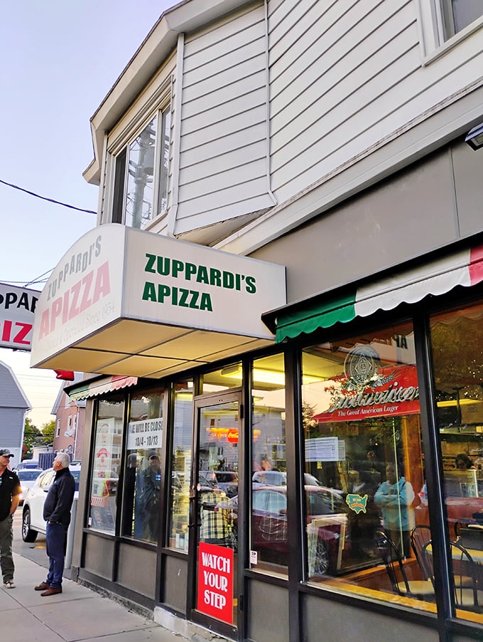 A slice of Americana! Zuppardi's Apizza stands proud, its unassuming exterior hiding a world of cheesy, saucy delights within.