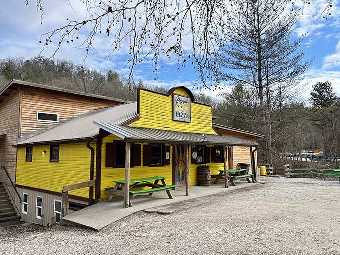 A splash of sunshine in the Kentucky woods! Miguel's Pizza stands out like a beacon of cheesy hope for hungry adventurers.