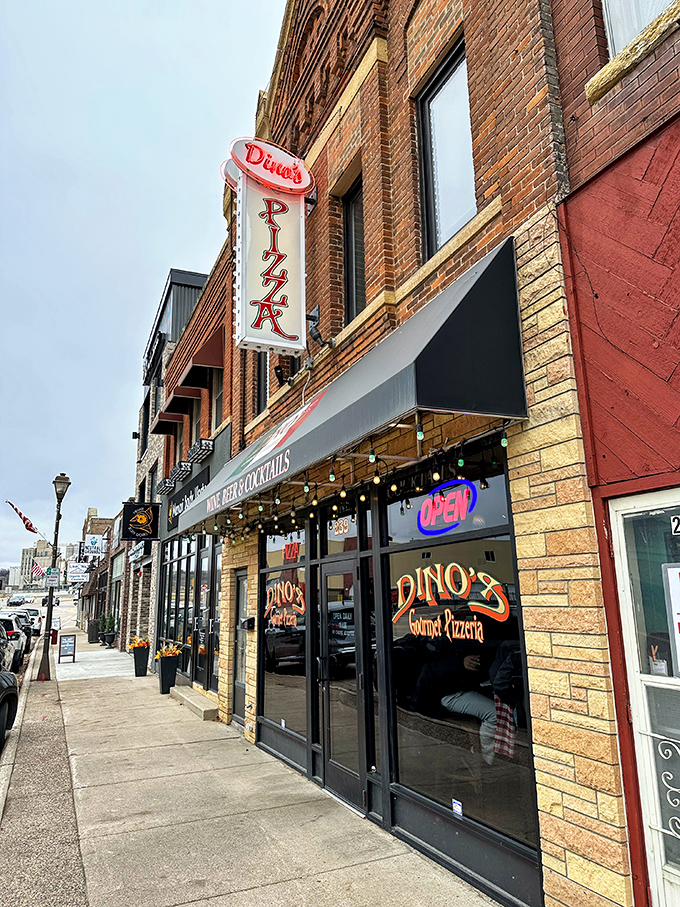 Welcome to pizza paradise! Dino's exterior beckons with the promise of cheesy delights and cozy charm.
