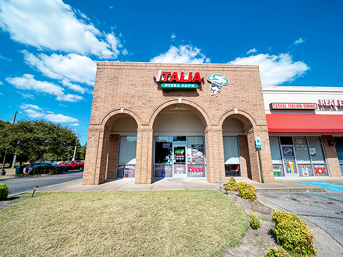 Welcome to pizza paradise! Italia Pizza Cafe's unassuming exterior hides a world of cheesy delights, proving you should never judge a book by its brick-and-mortar cover.
