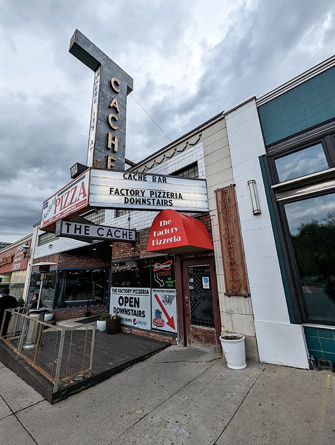 Welcome to pizza paradise! The Factory Pizzeria's vintage sign promises a slice of history with every bite.