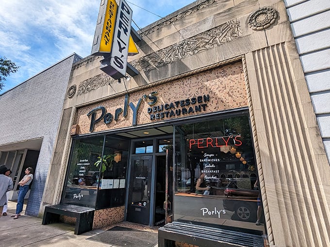 Perly's iconic storefront stands proud on Grace Street, its vintage yellow sign beckoning hungry Richmonders like a beacon of delicatessen delight.