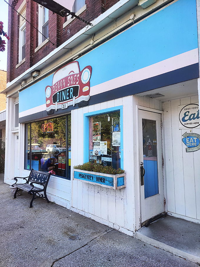 Welcome to Peggy Sue's, where the blue awning beckons like a retro beacon of breakfast bliss. Step inside and prepare for a time-warp to deliciousness!