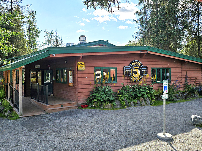 Chair 5 stands proudly against Alaska's dramatic mountain backdrop, its rustic wooden exterior promising comfort and culinary surprises within.