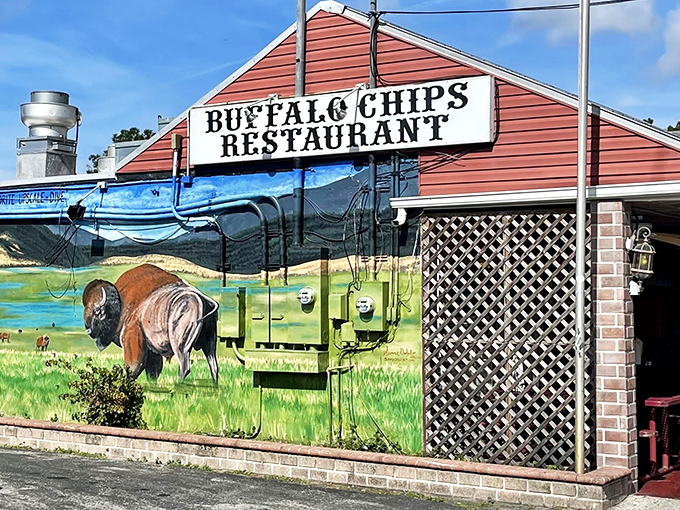 The unmistakable red exterior of Buffalo Chips, where that magnificent buffalo mural isn't just decoration&mdash;it's a promise of what awaits your taste buds inside.