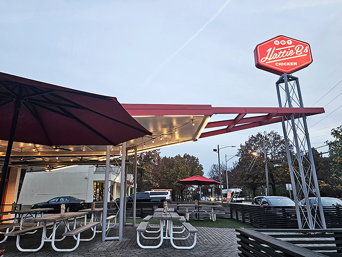 Welcome to flavor town! Hattie B's exterior promises a spicy adventure, with its bold signage and inviting storefront beckoning chicken enthusiasts.