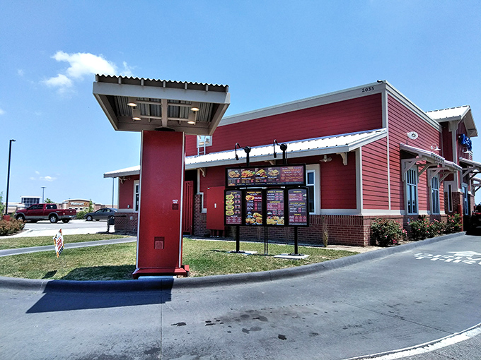 Welcome to flavor town! Zaxby's bold blue sign beckons like a neon lighthouse, guiding hungry souls to a chicken paradise.