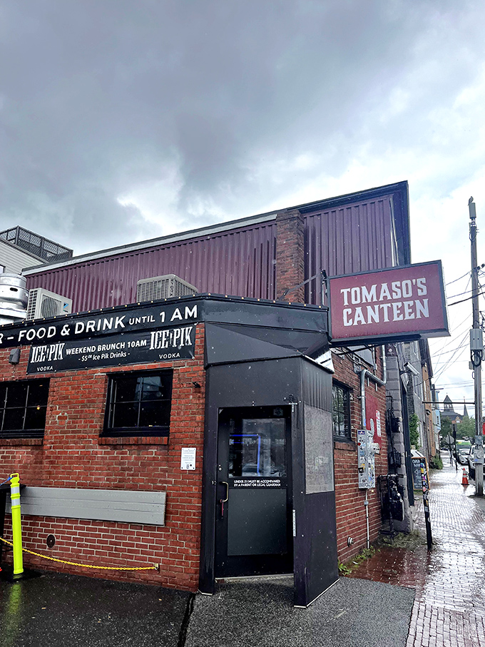 A brick facade that screams "hidden gem." Tomaso's Canteen: where culinary adventures begin and diet plans go to die.