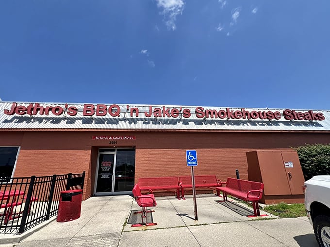 Welcome to flavor town! Jethro's BBQ 'n Jake's Smokehouse Steaks stands proud, its red-brick exterior promising a carnivore's paradise within. The aroma of slow-smoked meats practically wafts through the screen.