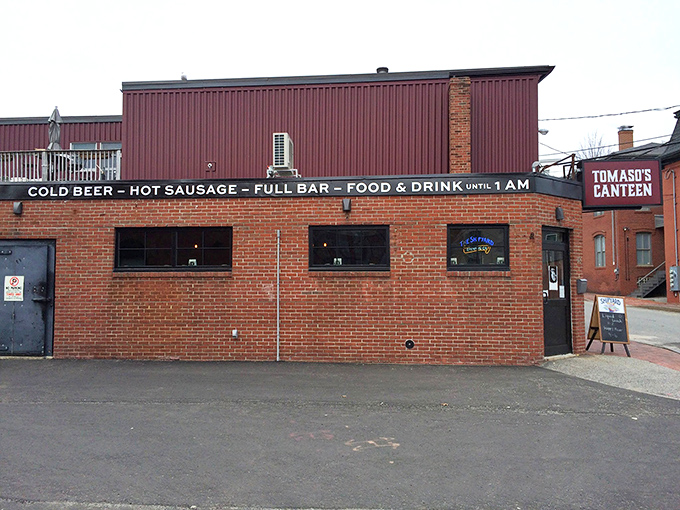 A brick facade that screams "hidden gem." Tomaso's Canteen: where culinary adventures begin and diet plans go to die.