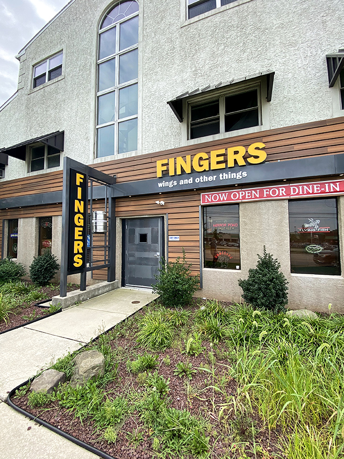 "Welcome to flavor town!" This unassuming exterior hides a world of wing-tastic delights, proving you can't judge a book by its cover &ndash; or a restaurant by its siding.
