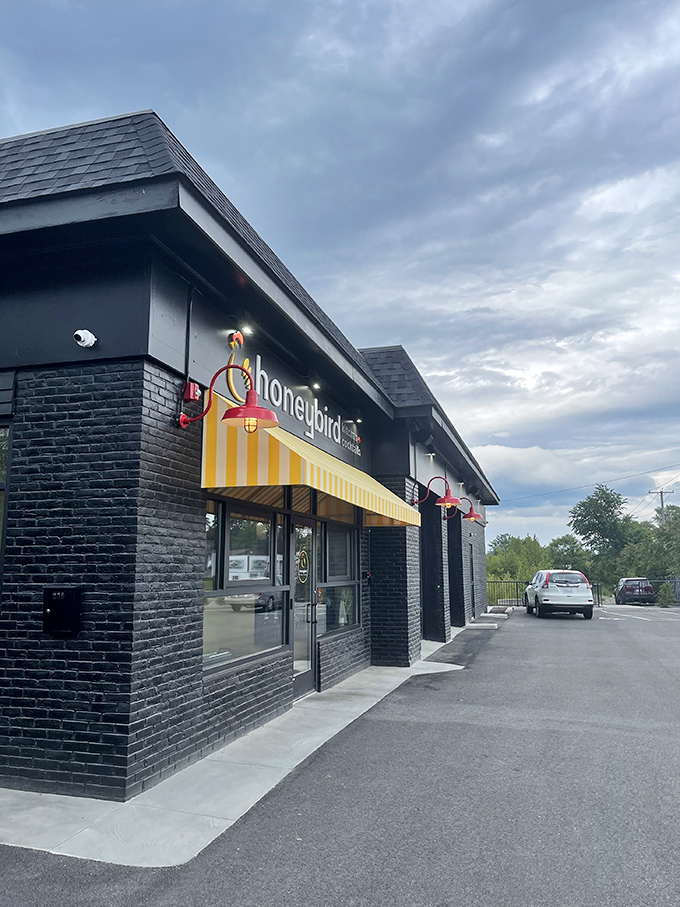 Honeybird's sleek black brick exterior stands like a beacon for fried chicken pilgrims. Simplicity outside, magic inside.