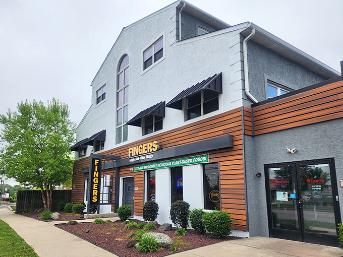 "Welcome to flavor town!" This unassuming exterior hides a world of wing-tastic delights, proving you can't judge a book by its cover &ndash; or a restaurant by its siding.