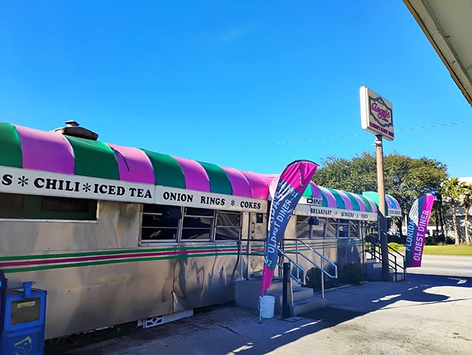 Step into a time machine disguised as a diner! Angel's Dining Car's exterior is a retro rainbow of promise, beckoning burger lovers with its iconic striped awning.
