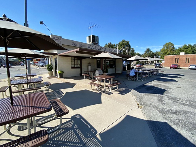 Step back in time! Wally's Drive-In looks like it was plucked straight out of a 1950s postcard, complete with retro signage and classic charm.