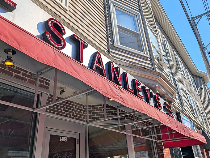 Step back in time! Stanley's iconic red awning and retro signage beckon you to a burger paradise that's been flipping patties since 1932.