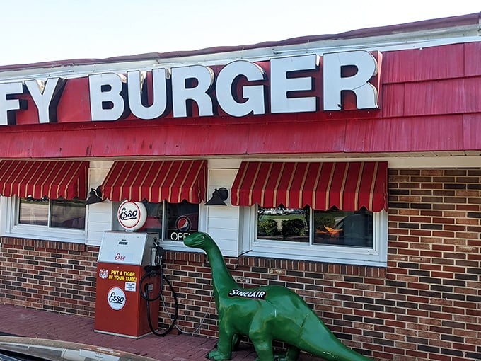 Welcome to burger paradise! Jiffy Burger's retro exterior promises a trip back in time, complete with friendly dinosaurs guarding the entrance. 