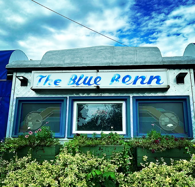 Step into a time machine disguised as a diner! The Blue Benn's exterior is a chrome-and-blue love letter to 1950s Americana.