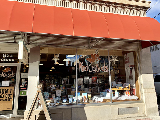 Step into a literary wonderland! Wind City Books' inviting storefront is like a siren call to bibliophiles, with its cheery red awning and tantalizing window displays.