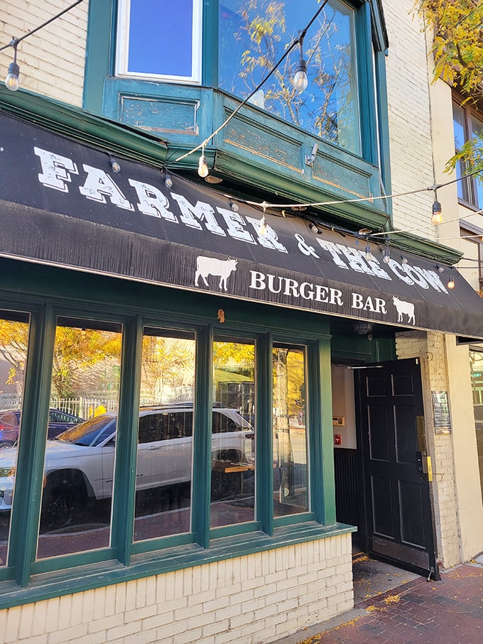 Welcome to burger paradise! Farmer & The Cow's charming storefront promises a feast for the senses and a challenge for your belt notches.