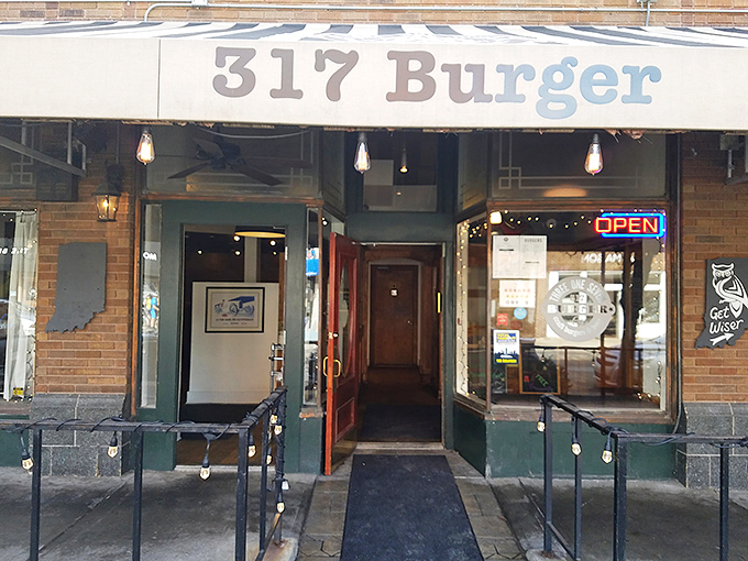Step into burger paradise! This charming brick facade promises a feast for the senses, with that striped awning waving you in like a friendly neighbor.