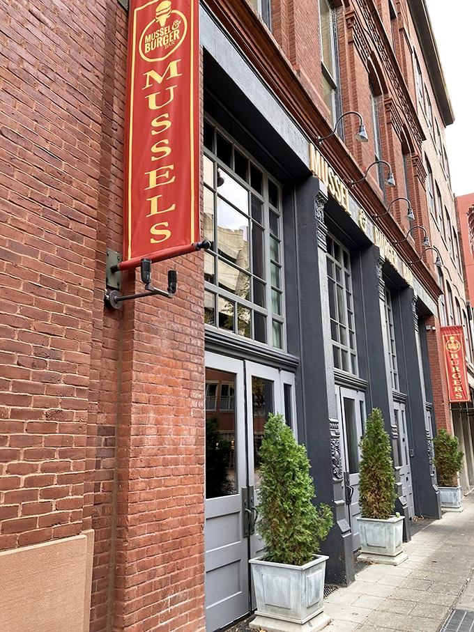 A burger beacon in the heart of Louisville! Mussel & Burger Bar's golden signage promises a feast for the senses.