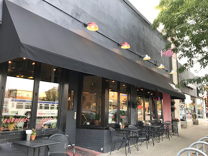 Welcome to burger paradise! Francis Burger Joint's sleek exterior promises a feast for the senses, with its inviting awning and warm glow beckoning hungry patrons.