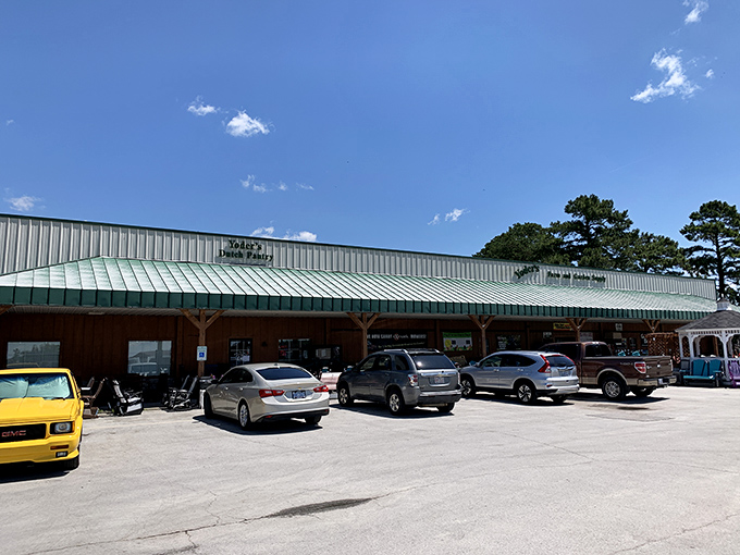 The unassuming exterior of Yoder's Dutch Pantry, where that blue gazebo practically whispers, "Sit a spell after you've consumed your weight in cinnamon rolls."