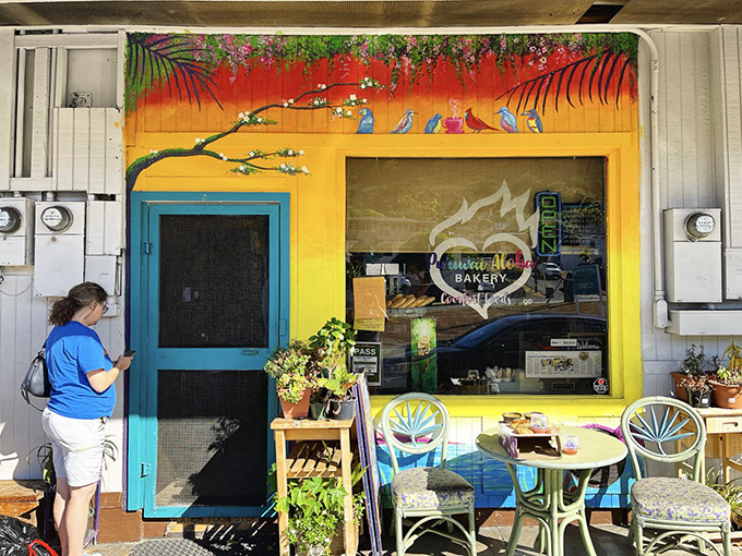 Welcome to carb paradise! Pu'uwai Aloha Bakery's cheerful exterior is like a beacon of hope for the sugar-deprived. It's the Willy Wonka factory of pastries, minus the Oompa Loompas.