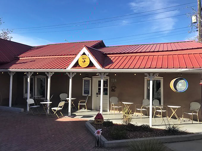 Welcome to carb heaven! The Flying Roadrunner Bakery's charming exterior promises a feast for the senses, with its inviting porch and rustic charm.