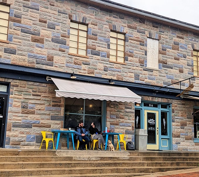 Stone-cold stunner! This historic facade houses a bakery that's anything but old-fashioned. Warm light and laughter spill onto the street, inviting you in.