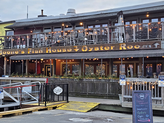Ahoy, seafood lovers! Boone's Fish House & Oyster Room beckons like a siren's call, promising oceanic delights and waterfront views that'll make you want to trade your car for a sailboat.