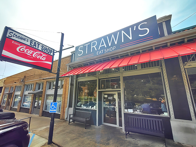 The iconic red awning of Strawn's beckons like a lighthouse for hungry souls. This unassuming brick storefront has been Shreveport's breakfast beacon since 1944.
