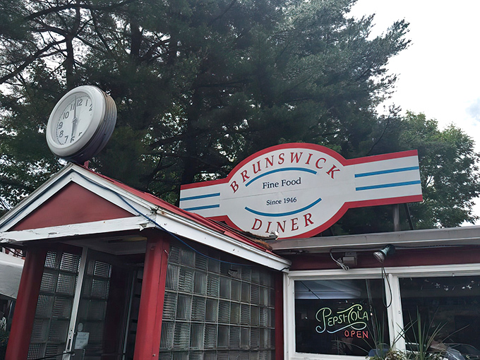 The fire-engine red exterior of Brunswick Diner stands like a beacon of breakfast hope, promising comfort food salvation to hungry travelers.