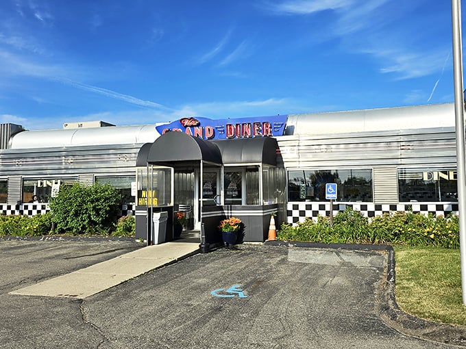 The gleaming stainless steel exterior of The Grand Diner stands like a time machine to the golden age of roadside Americana. Those neon letters promise more than food&mdash;they promise nostalgia.