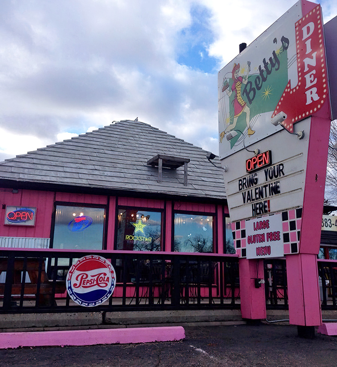 Step back in time! Betty's Diner's retro exterior, complete with a sassy cartoon waitress, promises a trip down memory lane and some seriously good eats.