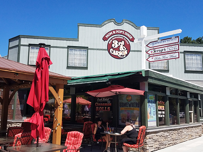 The cheerful exterior of Mom & Pop's Diner promises paradise in pancake form, with its inviting red umbrellas and laid-back Carson City charm.