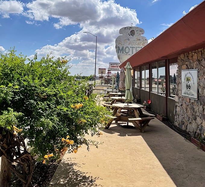 The mid-century architecture of Kix on 66 stands proudly against the New Mexico sky, a time capsule serving comfort on a plate.