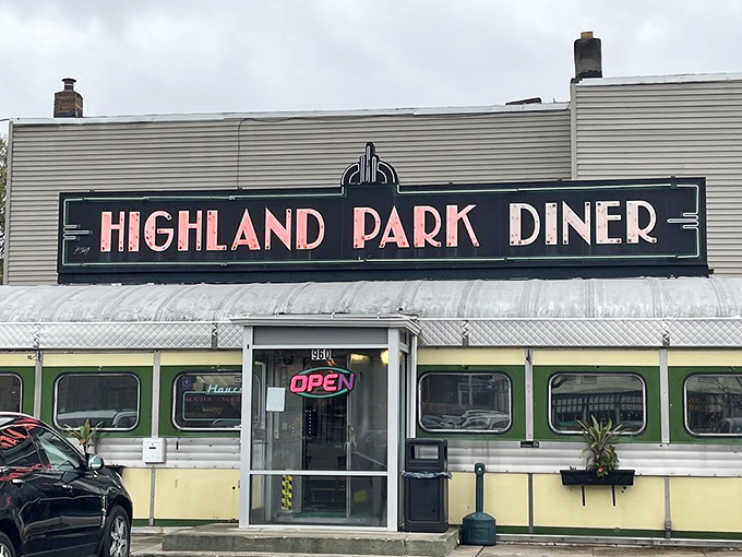 The gleaming stainless steel exterior of Highland Park Diner stands as a time capsule of Americana, beckoning hungry travelers with nostalgic charm.