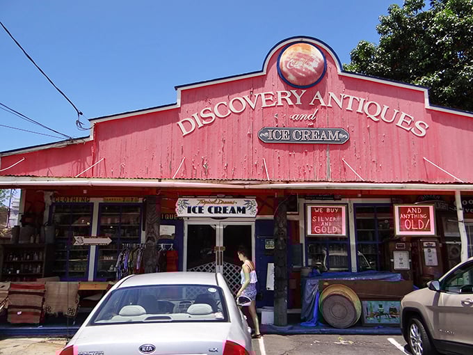 Welcome to the Technicolor dreamcoat of antique stores! This vibrant red barn isn't just eye-catching; it's a siren call to treasure hunters and ice cream lovers alike.