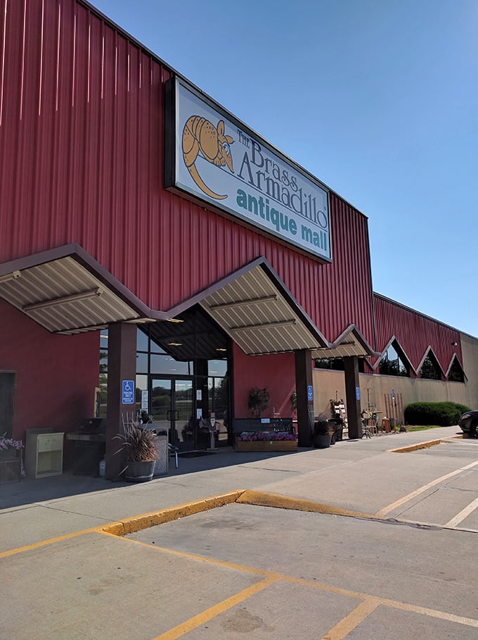 Welcome to the Brass Armadillo, where time travel is just a step through these red doors! This antique mall is like a giant, friendly barn filled with treasures.