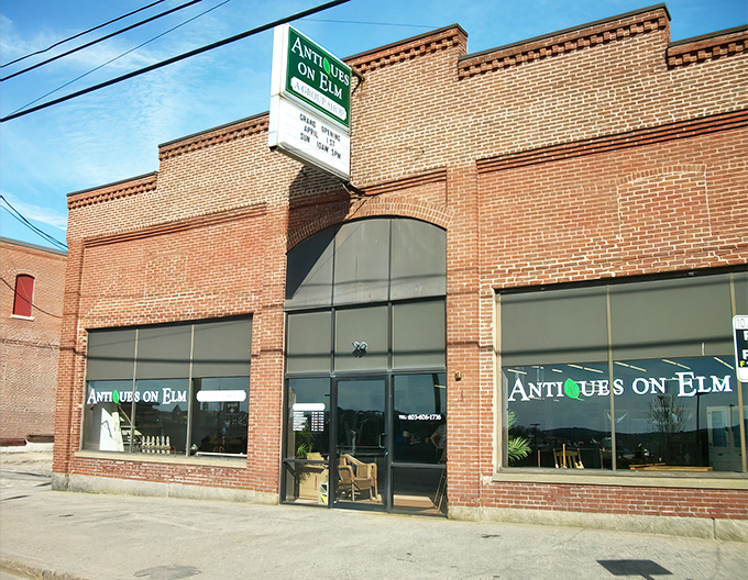 Step into a time machine disguised as a brick building! Antiques on Elm beckons with its charming storefront, promising treasures from every era.