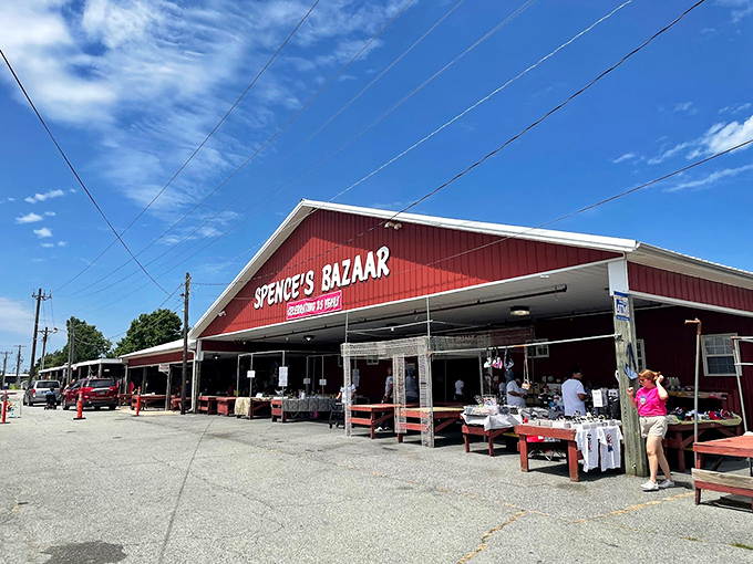 Welcome to bargain paradise! Spence's Bazaar stands proud, a red-roofed beacon of treasure-hunting joy under Delaware's big blue sky.