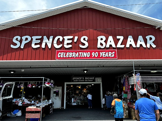 Welcome to bargain paradise! Spence's Bazaar stands proud, a red-roofed beacon of treasure-hunting joy under Delaware's big blue sky.